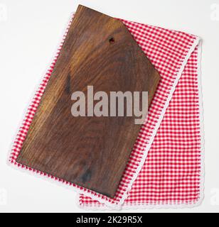 Cutting board with cotton napkin on wooden table Stock Photo - Alamy