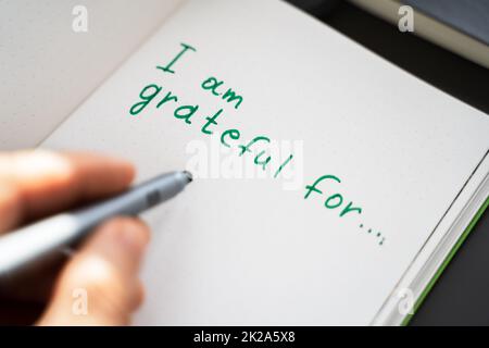 Gratitude Journal Concept. Writing I Am Grateful In Journal Stock Photo ...