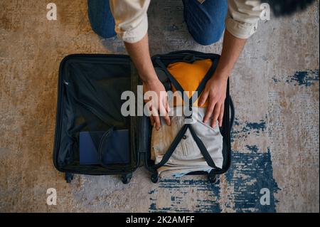 The businessman preparing packing for business trip Stock Photo - Alamy