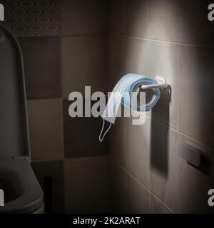 The roll of medical masks on the holder Stock Photo - Alamy