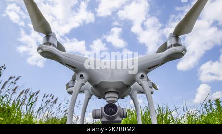Quadrocopters on a plastic box in the grass Stock Photo - Alamy