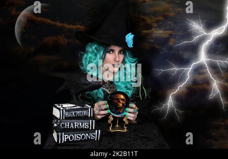 Witch With Crystal Ball and Spell Books Stock Photo - Alamy