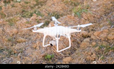 The drone, hovering above the ground Stock Photo - Alamy