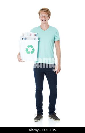Young handsome man recycling paper looking positive and happy standing ...