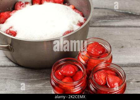 Sugar-covered summer berries in a pan, high angle view Stock Photo - Alamy