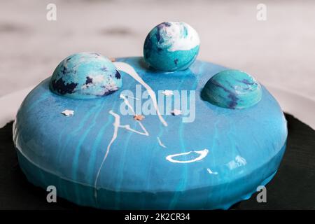Blue mousse cake with blue chocolate balls Stock Photo - Alamy