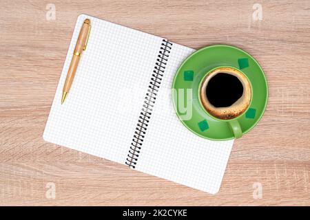Notebook with a cup of coffee and a pen with the text INVITATION TO ...