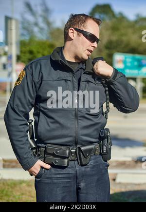Young security guard driver in sunglasses sitting inside car looking ...