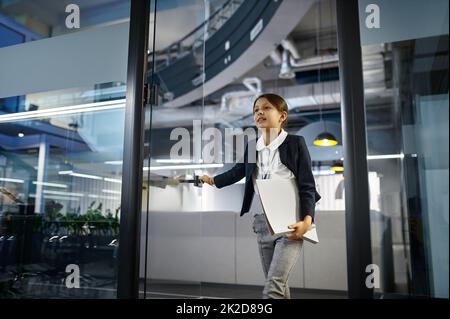 Business girl entering conference room with smile Stock Photo - Alamy
