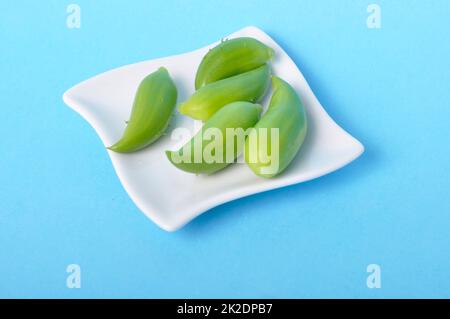 Achocha in a saucer on a blue background Stock Photo - Alamy