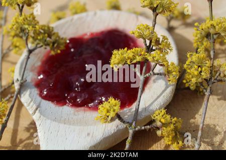 cornel cherry blossoms and cornel cherry marmalade Stock Photo - Alamy