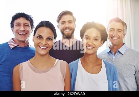 Together a team achieves more. a group of kids playing a game of tug of ...