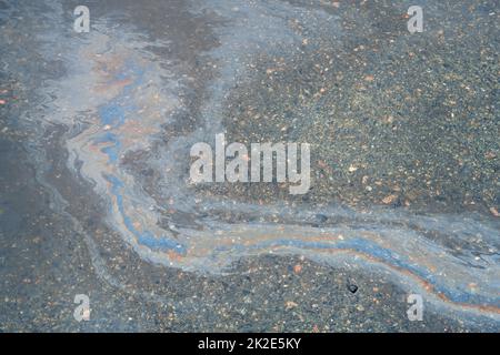 Dirty multi-colored stain from engine oil on asphalt Stock Photo - Alamy