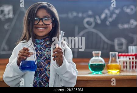 Little girl doing science experiment. Kindergarten. Education concept ...