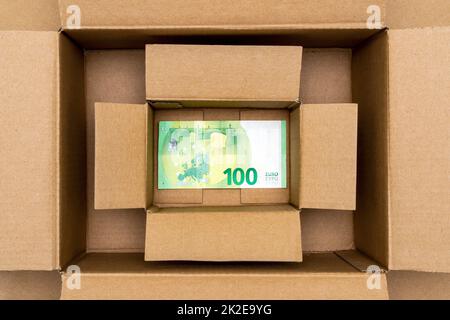 One Hundred Euros banknote in open box made from corrugated cardboard ...