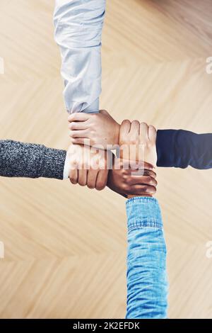 Were in this together. a group of unrecognizable businesspeople ...