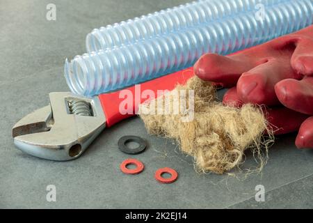 serrated kitchen drain pipe and wrench Stock Photo - Alamy