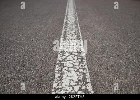 Asphalt road with single solid white line road marking Stock Photo - Alamy