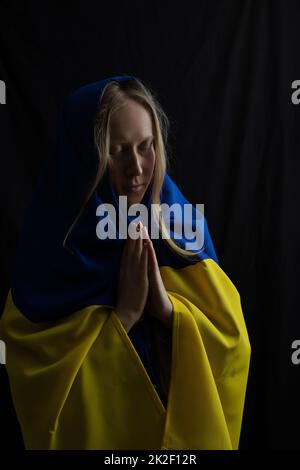 Woman praying, God save Ukraine Stock Photo - Alamy