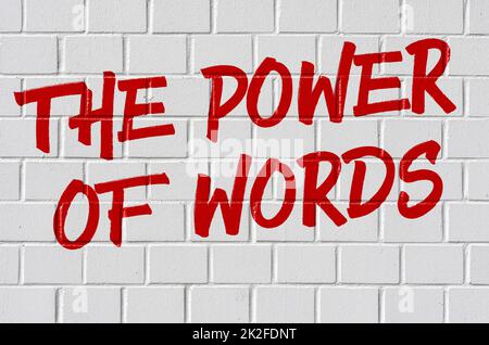 Graffiti on a brick wall - The power of words in german Stock Photo - Alamy