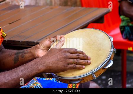 Brazilian samba performance with musician playing tambourine in the ...