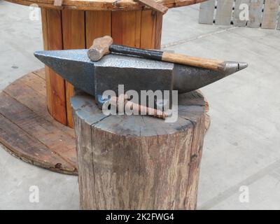 Blacksmith at work, hit with a hammer by a hot metal on the anvil Stock ...