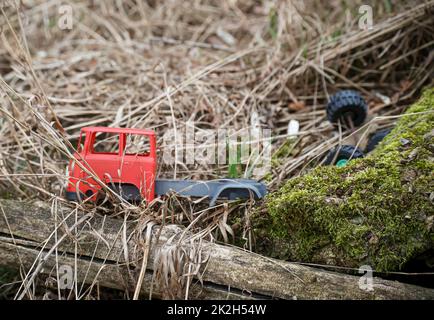 An old thrown away car, toy car in nature, probably of Russian origin ...