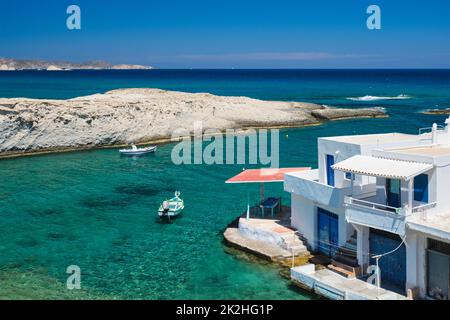 Crystal clear blue water at Mitakas village beach, Milos island, Greece ...