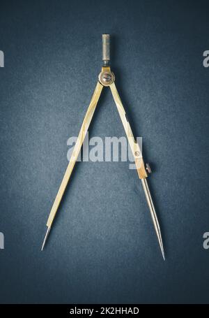 Old vintage pair of compasses on dark background Stock Photo - Alamy