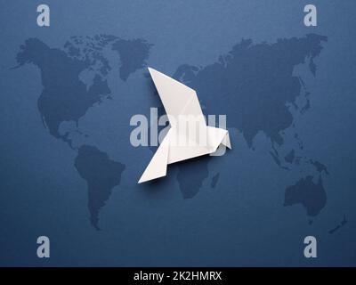White origami pigeon on a blue paper background Stock Photo - Alamy