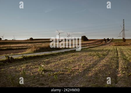 rural landscape with empty fields and wind turbines Stock Photo - Alamy
