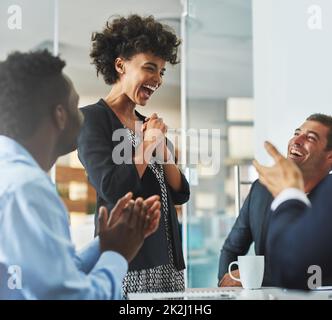 Laugh out loud moments at work. Shot of colleagues laughing together in ...
