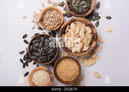 Top view of pumpkin, sunflower and flax seeds for healthy nutrition on ...