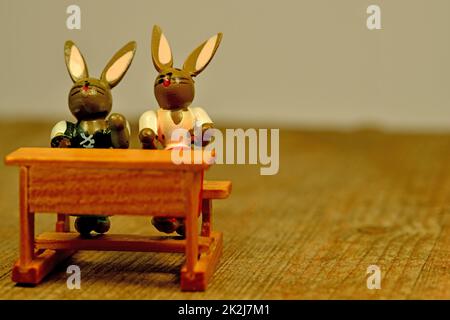 easter bunnies on the school bench Stock Photo - Alamy