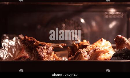 The lamb cooked in the oven close-up colored Stock Photo - Alamy