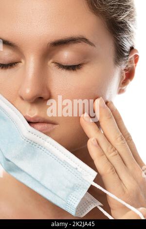 Maskne - acne breakouts from wearing a face mask Stock Photo - Alamy