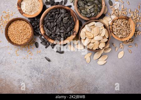 Top view of pumpkin, sunflower and flax seeds for healthy nutrition on ...
