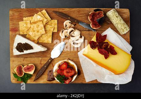 High angle shot of some fresh and delicious cherries and some leaves on ...