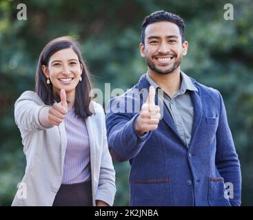 Female corporate with two thumbs up. Female office worker giving thumbs ...