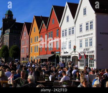 Warehouses with typical red wooden facades and fishing boats in the ...
