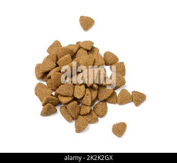 a pile of cat food on white background Stock Photo - Alamy
