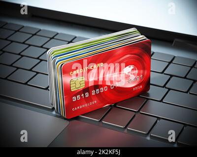 Credit cards standing on laptop computer keyboard. 3D illustration ...