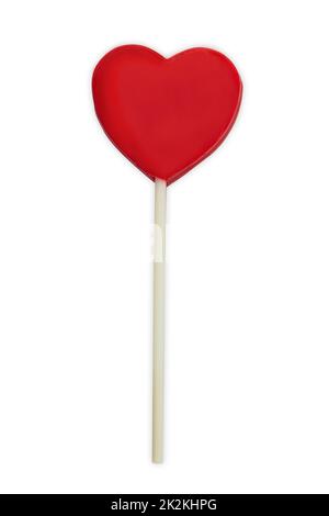 Red heart shape lolly pop on the black wooden background with empty ...