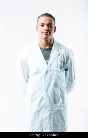 competent doctor in a white coat. isolated on a white Stock Photo - Alamy