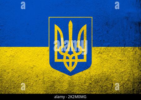 Ukrainian national flag with Coat of arms of Ukraine tryzub. Grunge ...