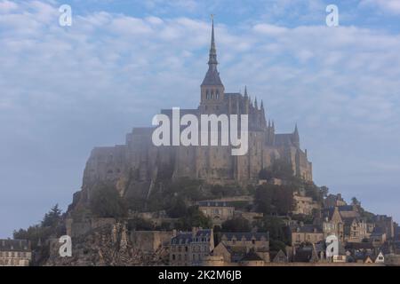 Foggy view of Le Mont Saint-Michel (Saint Michael's Mount), a small ...