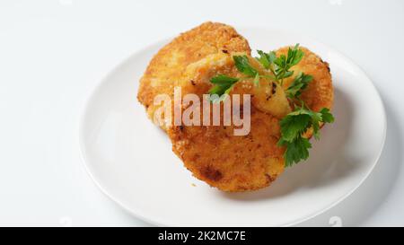 Chicken cutlets with parsley on white plate Stock Photo - Alamy