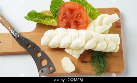 Turkish Knitting, Knitted Cheese on Wooden Board. Natural local cheeses ...