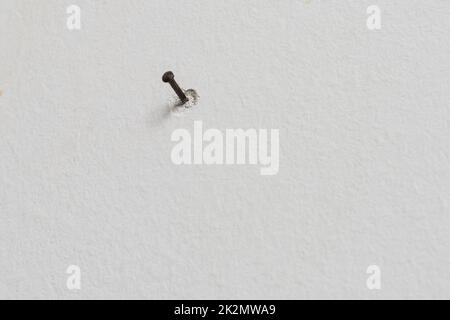 Nail driven into the wall Stock Photo - Alamy