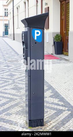 Parking slot on a paved sidewalk between buildings Stock Photo - Alamy
